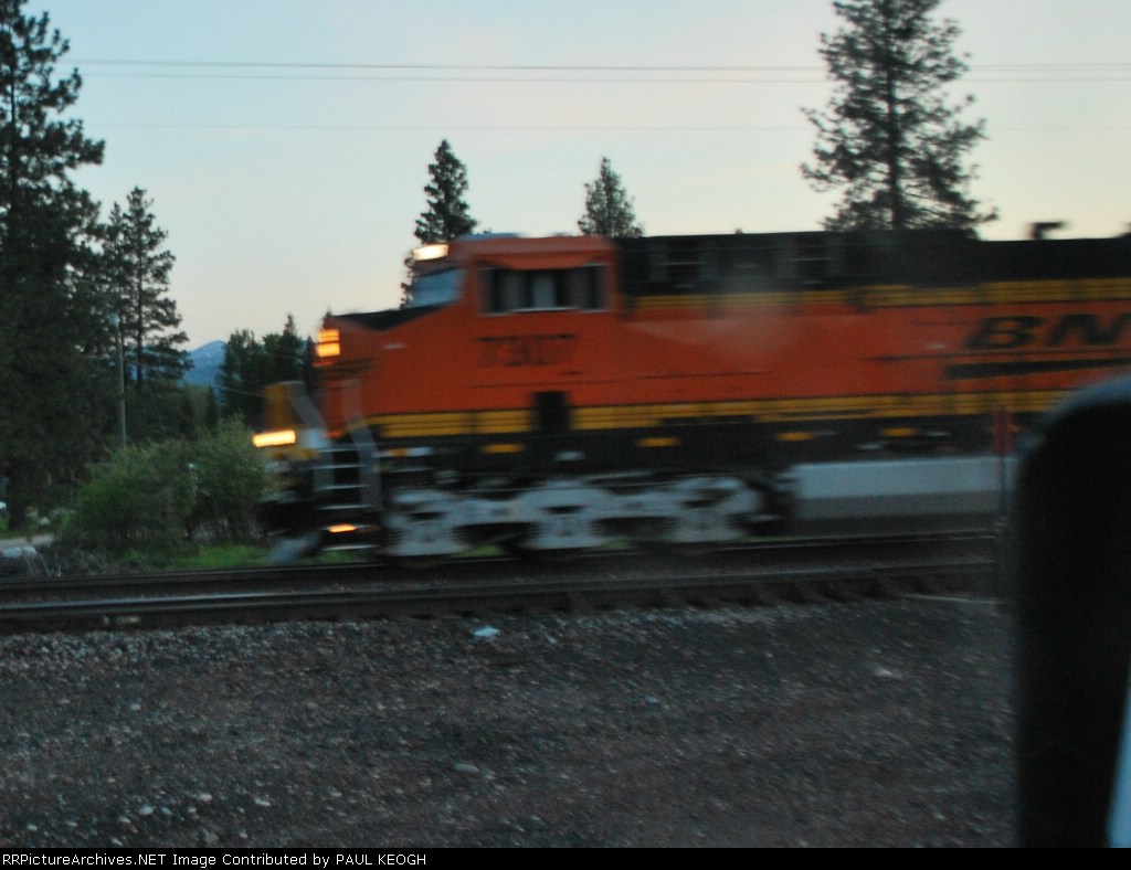 BNSF 7307 flashes past me in this early 0539 am shot as she leads a westbound Z into Whitefish ...